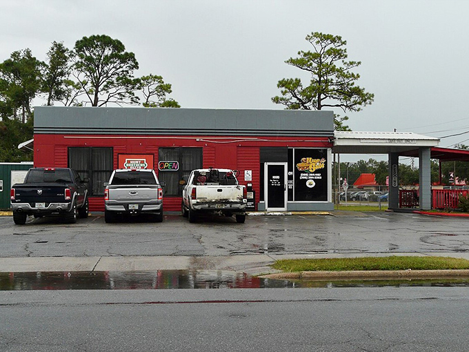 This unassuming red building houses Mayo Subs, where sandwiches come without pretension and the parking lot tells you everything about its local authenticity.