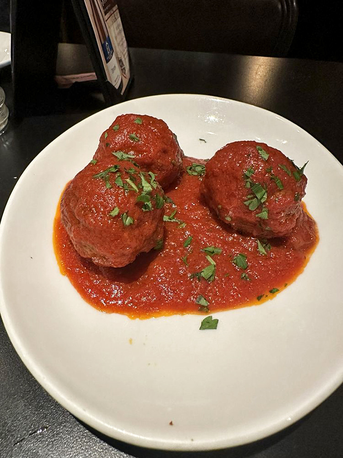 These meatballs aren't just food; they're time machines to Sunday dinners at your Italian grandmother's house—even if you never had one.