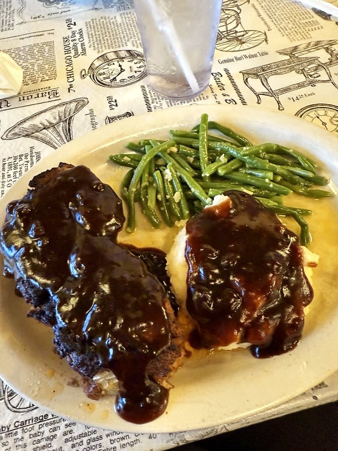 This isn't just meatloaf; it's a masterclass in comfort &ndash; glistening with tangy glaze and paired with green beans that actually taste like vegetables should.