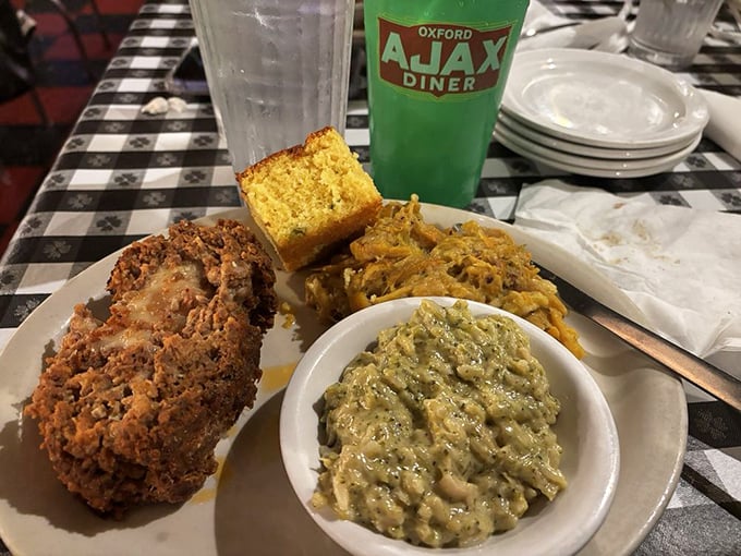 Ajax's meatloaf with that signature cornbread square &ndash; proof that the simple things in life, when done right, can be the most extraordinary.