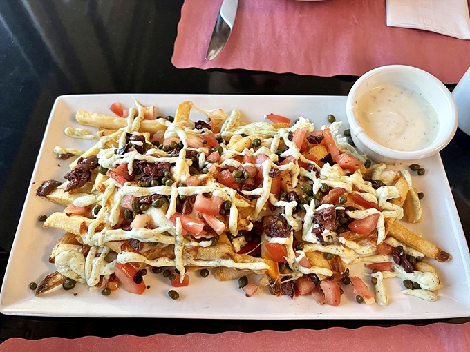 These aren't just fries&mdash;they're a Mediterranean vacation, where tomatoes, feta, and a drizzle of sauce transform the humble potato into something worth fighting over.