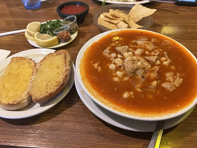 Menudo: the legendary hangover cure that's worth ordering even when you're perfectly fine. That side of garlic bread knows exactly what it's doing.