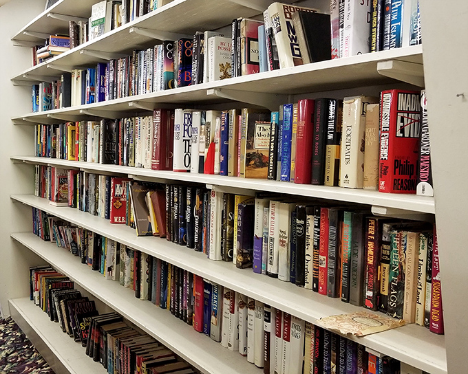 A library of possibilities waiting to be discovered. Each spine represents someone's favorite story looking for its next reader.