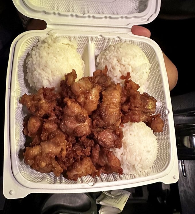 Mochiko chicken surrounded by rice like tiny islands&mdash;a plate lunch that explains why locals line up at lunchtime.