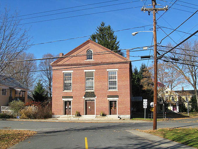 Montague Center's brick library stands solid and dependable, much like your decision to retire somewhere your pension actually matters.