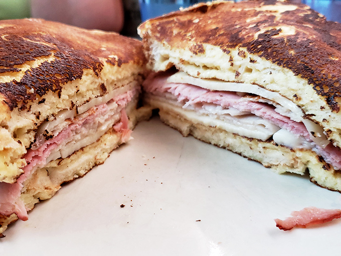 The Monte Cristo: where breakfast and lunch collide in a glorious stack of ham, turkey, and French toast that makes you question why we separate meals.