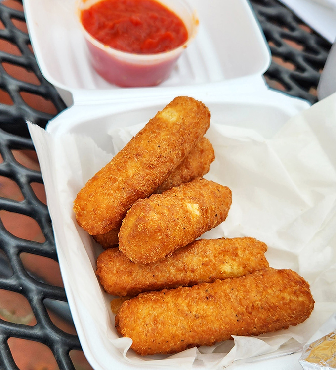 Golden-brown mozzarella sticks with marinara &ndash; the universal language of "yes, you deserve this" spoken fluently at Shank's.