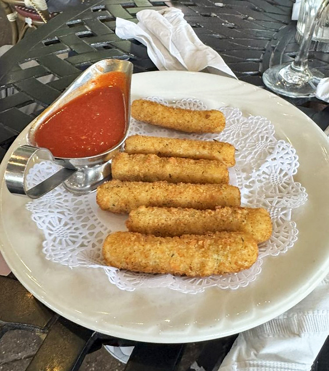 Mozzarella sticks: the universal language of appetizer happiness. These golden beauties with their marinara sidekick are irresistibly dippable.