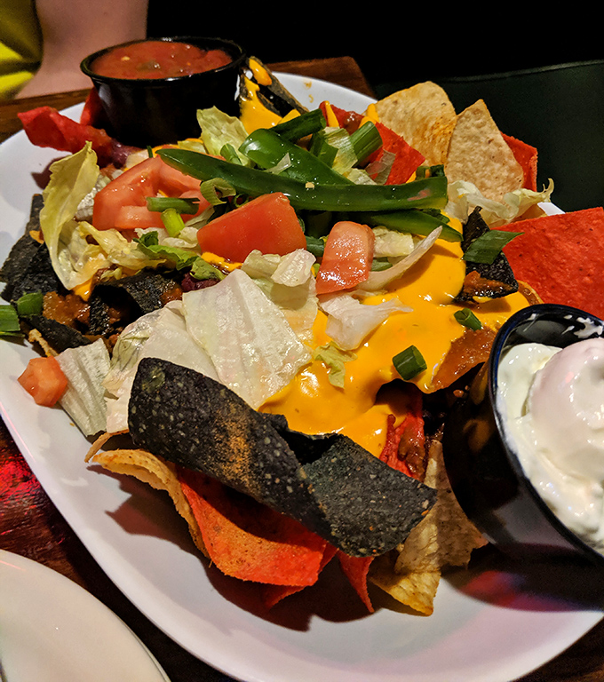 Nachos that don't mess around, loaded with enough toppings to require a structural engineering degree to eat properly &ndash; challenge accepted!