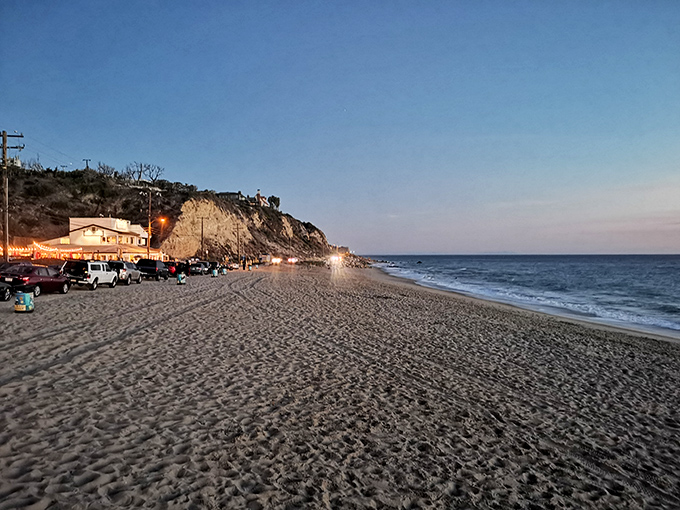 As evening approaches, the beach empties but doesn't lose its magic&mdash;that twilight moment when the day-trippers leave and the dreamers inherit the shore.