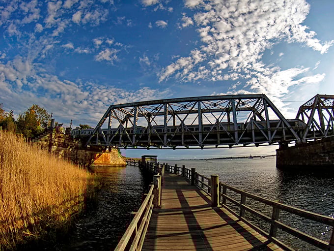 Not just a bridge, but a passage between worlds&mdash;where weathered boardwalks lead to industrial elegance spanning the waters that shaped Old Saybrook's destiny.