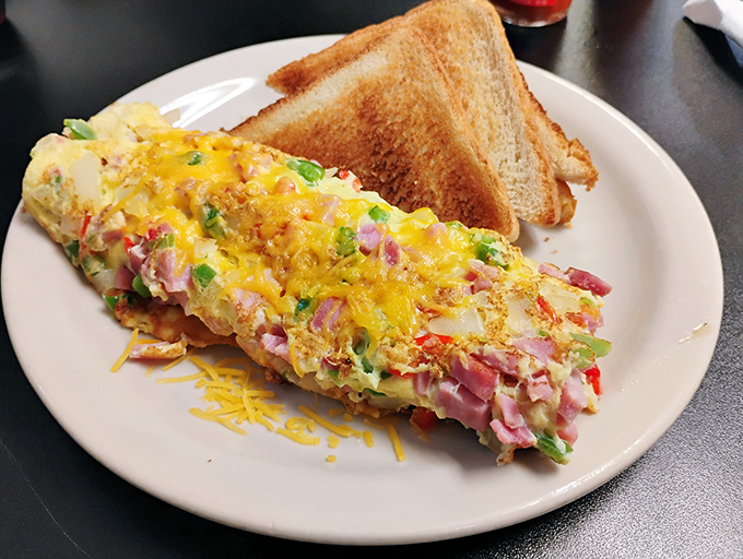 This isn't just an omelet&mdash;it's a colorful canvas of diced ham, peppers, and cheese that makes breakfast feel like the most important meal of the day.