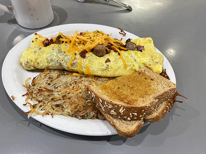 This omelet, toast, and hash brown trio performs a harmonious breakfast symphony that makes you wonder why you ever settle for cereal.