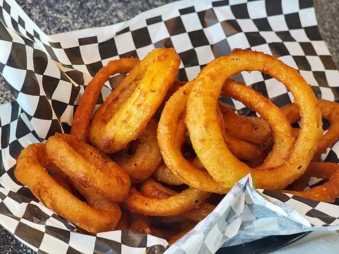 Onion rings with the kind of crunch that announces itself to the entire diner. Worth every second of the onion breath that follows.
