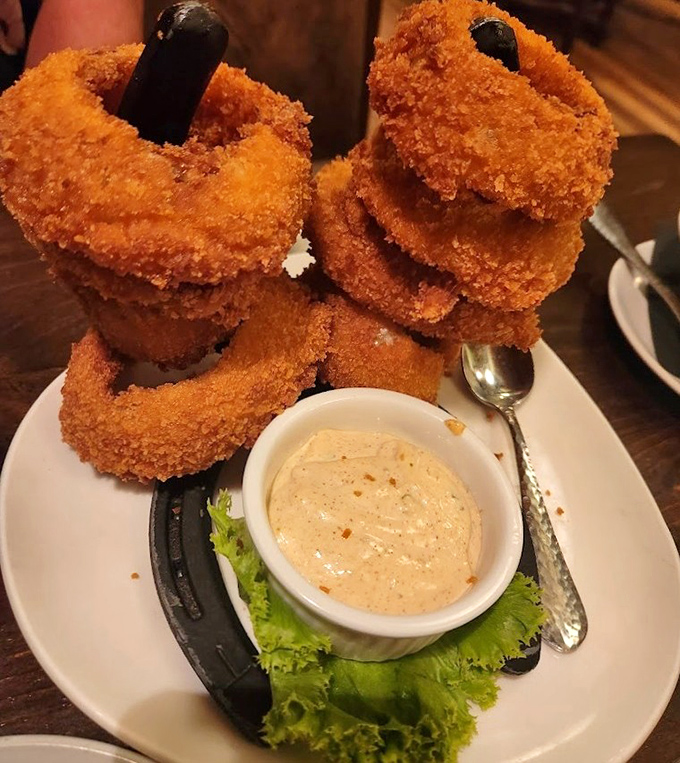 These aren't just onion rings&mdash;they're golden halos of happiness stacked higher than your weekend expectations.
