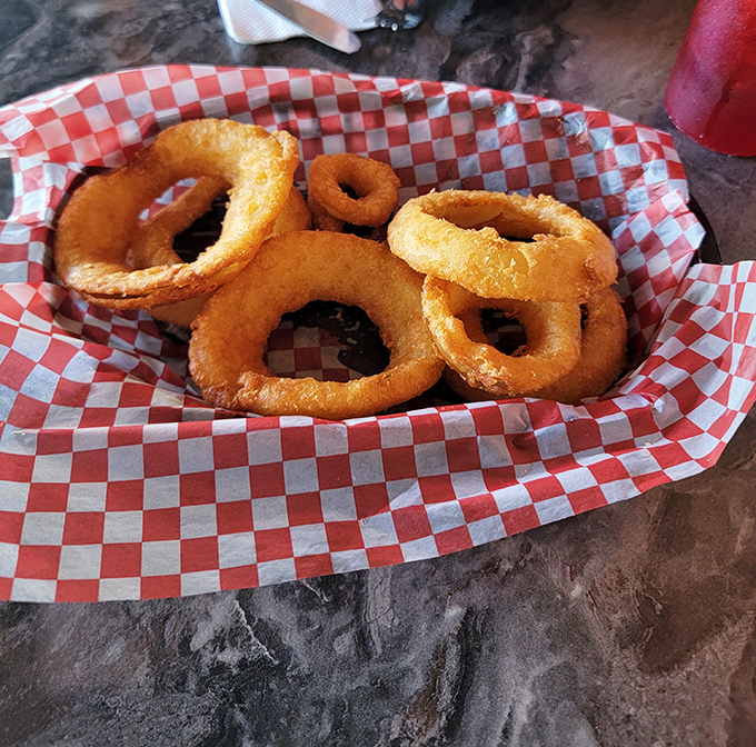 Golden onion rings that deserve their own standing ovation &ndash; crispy perfection achieved.