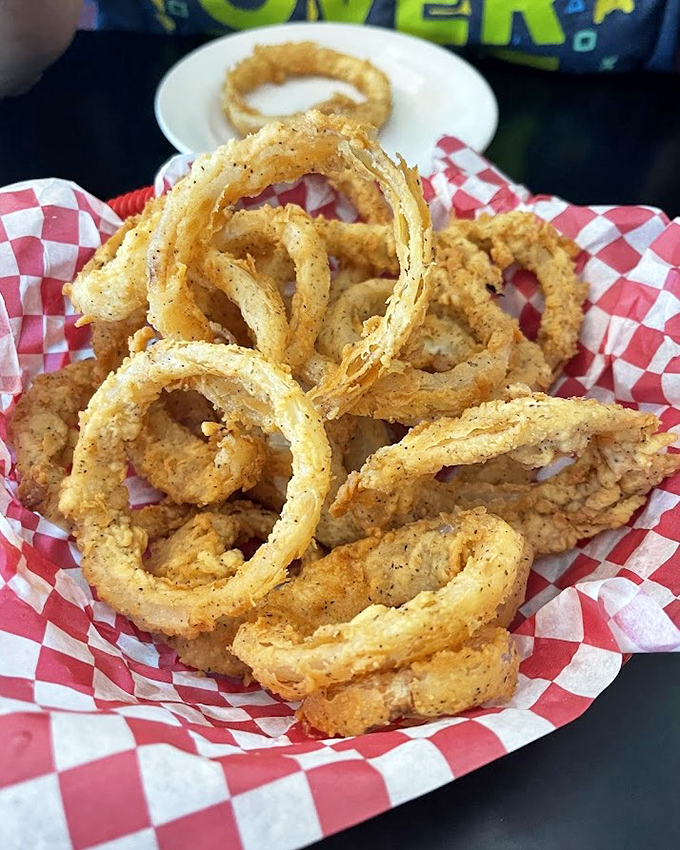 Onion rings so perfectly golden and crispy, they could make a grown person weep tears of fried joy.