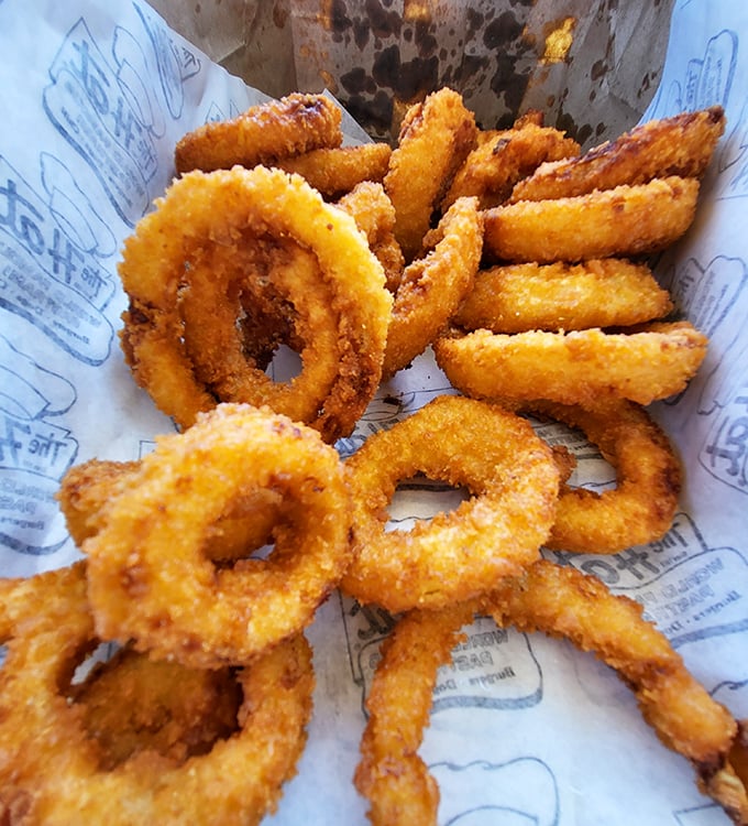 Onion rings with the perfect crunch-to-tenderness ratio. These golden halos deserve their own fan club and commemorative t-shirt.