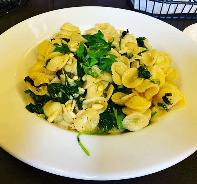 Orecchiette with spinach &ndash; little "ears" of pasta catching pockets of flavor in every bite. Simple ingredients, executed with respect.