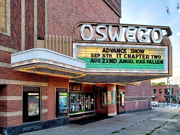 The vintage Oswego Theater marquee lights up downtown evenings, proving some entertainment experiences can't be replicated on a smartphone screen.