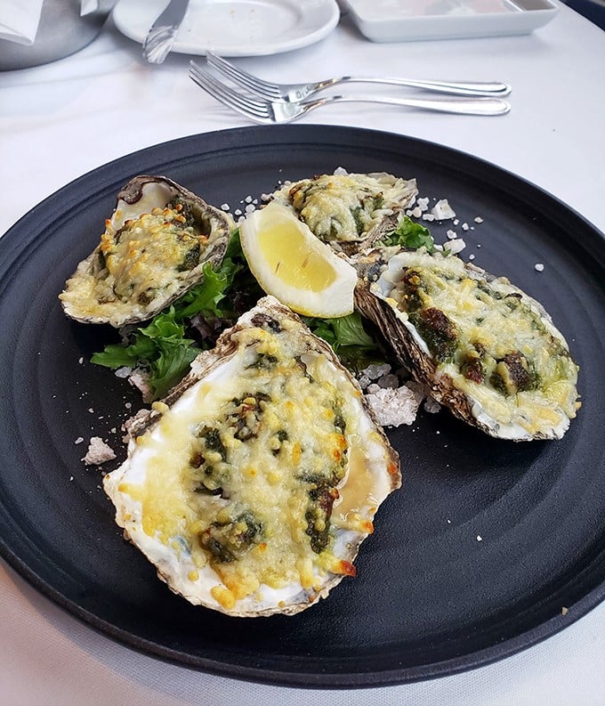 Oysters Rockefeller so decadent they should come with their own tax bracket. That melted cheese blanket is pure comfort atop briny bliss.