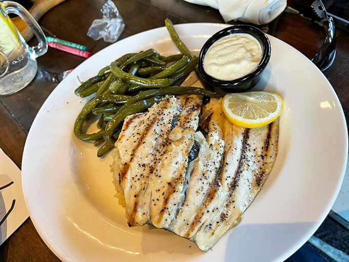 The Ozarks Trout Almondine proves that sometimes simple is spectacular &ndash; delicate fish, crisp green beans, and a squeeze of lemon is all you need.