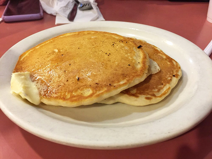 Pancakes so perfectly golden they belong in Fort Knox. The kind that make you wonder why anyone bothers with fancy brunch when this exists.