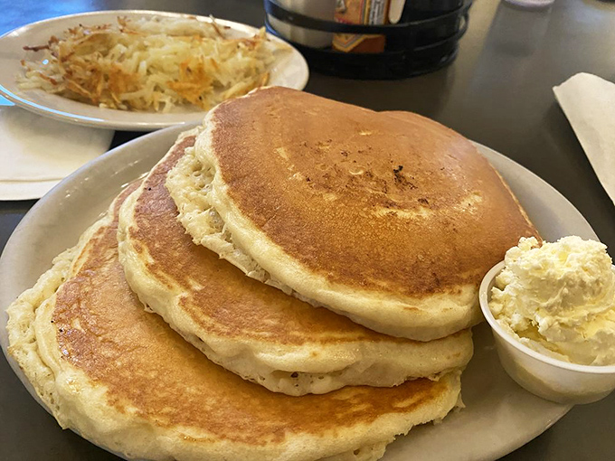 Pancakes stacked higher than some Wyoming snowdrifts. That butter pat isn't melting&mdash;it's surrendering to inevitable delicious destiny.