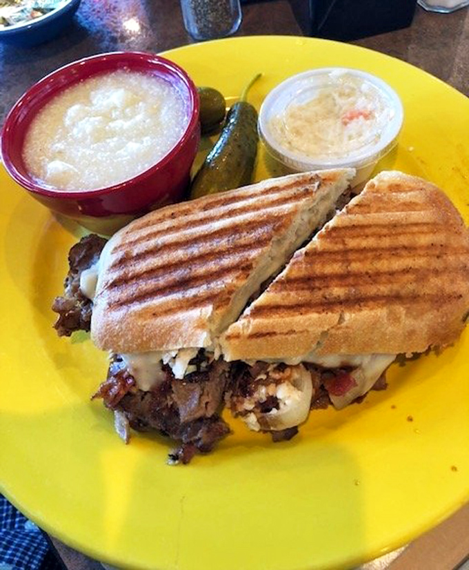 This panini isn't messing around, bringing melty cheese and savory fillings to the party alongside creamy grits—a Tennessee twist on lunch classics.