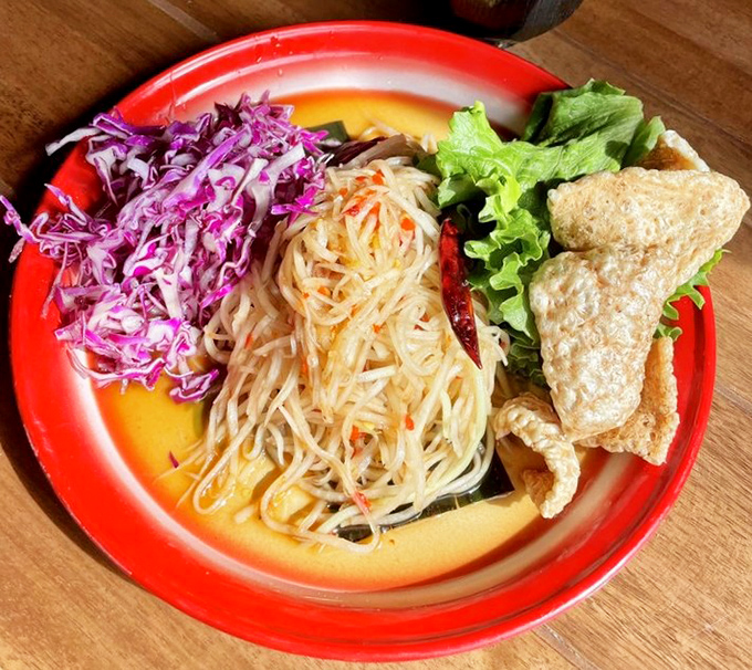 This papaya salad is a color explosion that delivers the perfect balance of sweet, sour, spicy and savory in every crunchy bite.