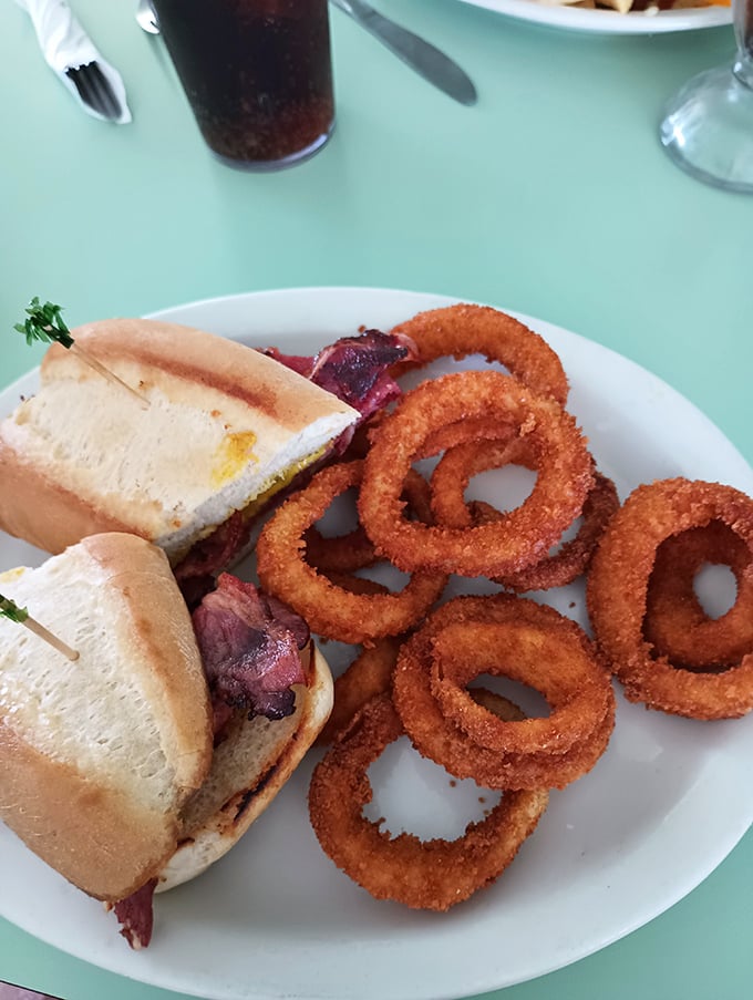 A pastrami sandwich flanked by golden onion rings &ndash; the lunch combo that's been making afternoon meetings "suddenly canceled" since the Eisenhower administration.
