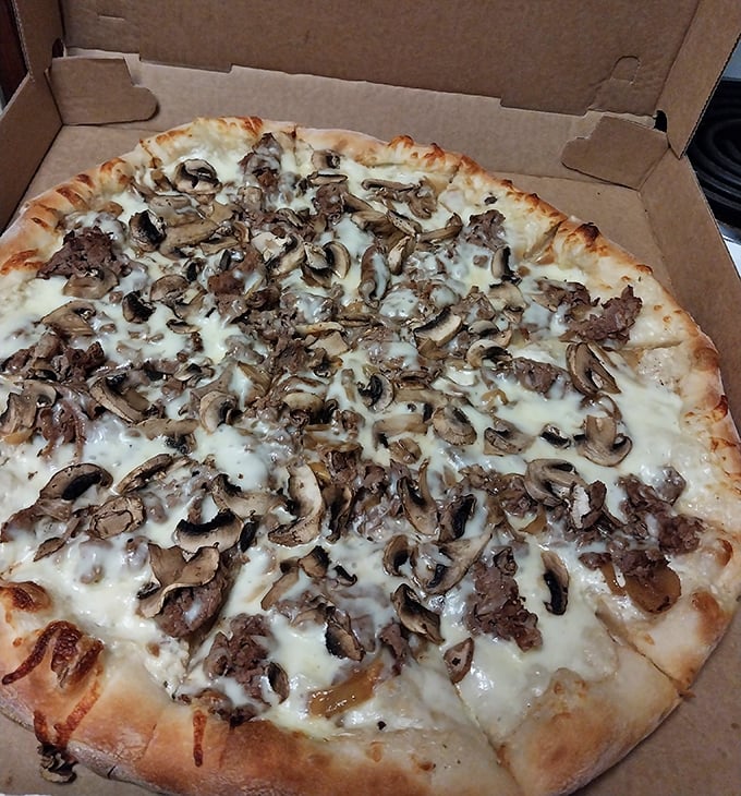 Mushrooms and steak playing together on a pizza playground. This isn't fusion cuisine&mdash;it's a delicious friendship that makes perfect sense.