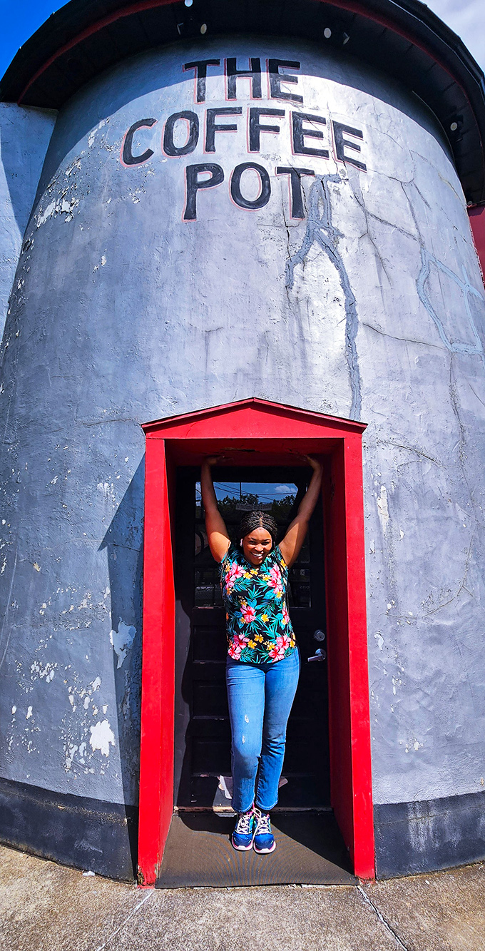 I fit inside a giant coffee pot! The red doorway frames visitors perfectly for that essential vacation photo that friends won't believe.