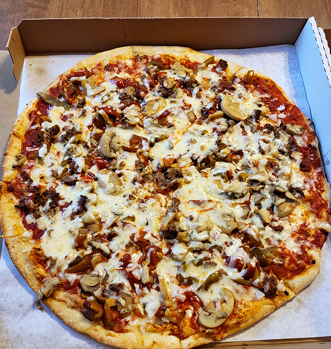 Pizza perfection with mushrooms and meat playing the lead roles. That crust has the kind of character development most Netflix shows wish they could achieve.