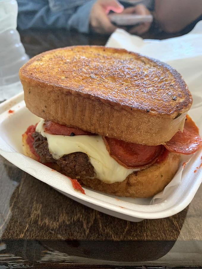 The Pizza Burger brings two comfort food classics together in one glorious creation. It's like your two best friends finally decided to hang out.