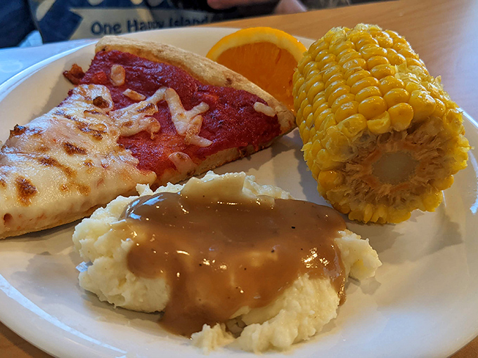 Pizza, corn on the cob, and mashed potatoes prove that buffet dining means never having to pick just one food group or cuisine.