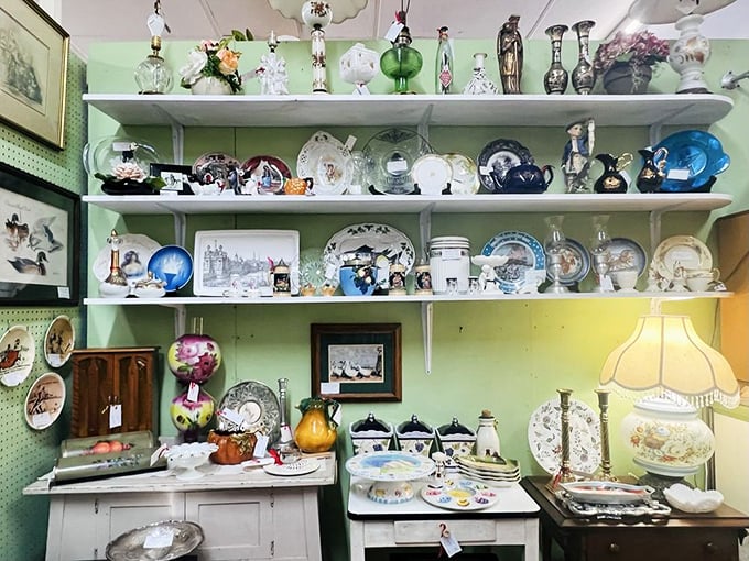 A mint-green wall of porcelain treasures that would make your grandmother swoon. China patterns competing for attention like contestants on a vintage game show.