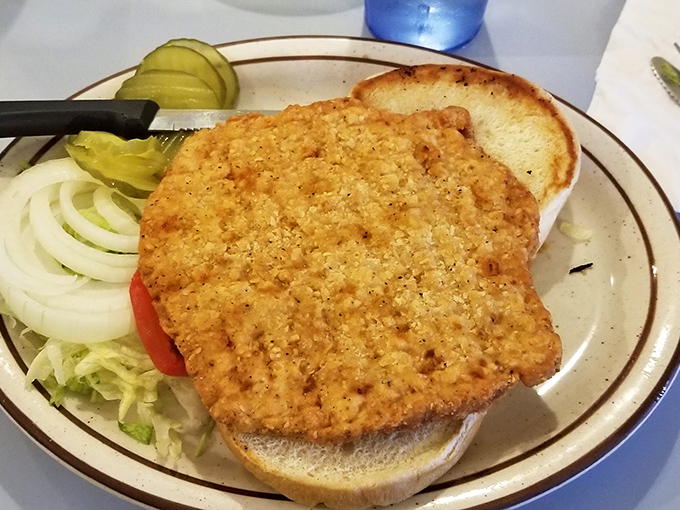 Iowa's pork tenderloin sandwich &ndash; where the meat extends well beyond the bun's jurisdiction, as tradition demands.