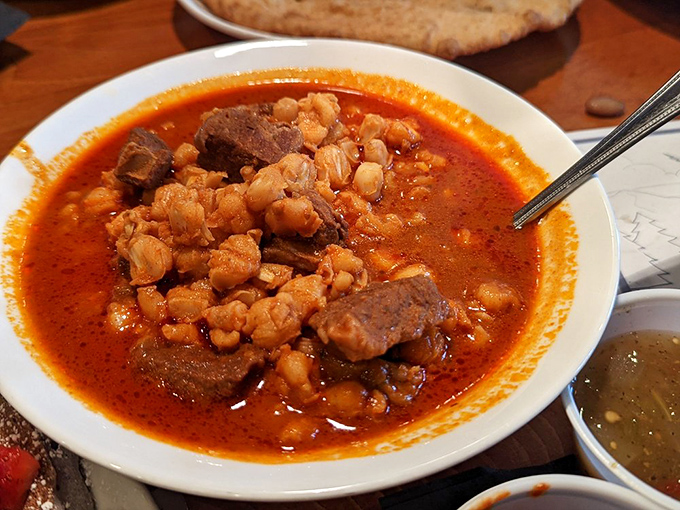 A bowl of posole that could warm the coldest day. Those hominy kernels and tender meat swimming in red chile broth are basically a hug in food form.