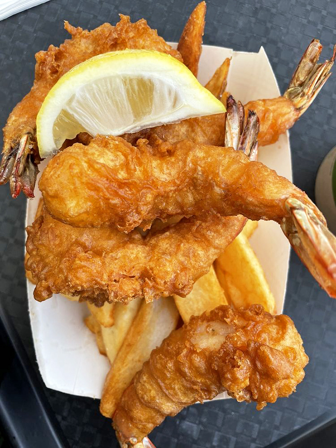 Battered prawns with their tails still on, served with fries, because Fort Bragg doesn't mess around with portion sizes.