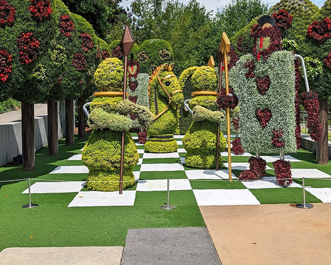 The garden's chess set brings strategy to life with knights, queens and pawns locked in an eternal game where every piece is trimmed to perfection.