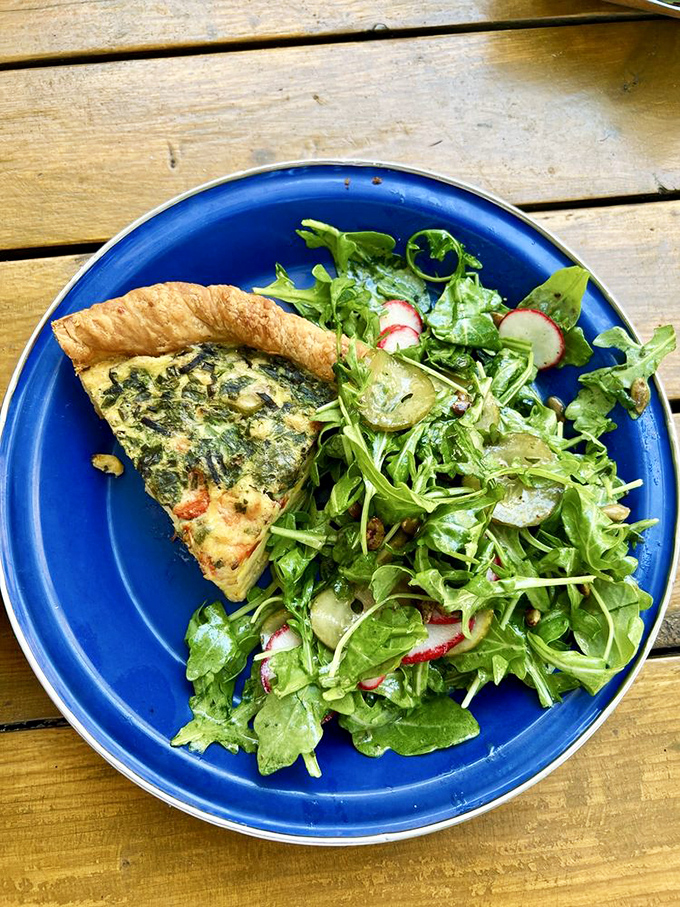 Quiche and greens: the adult version of having your cake and eating vegetables too. That crust edge deserves its own fan club.