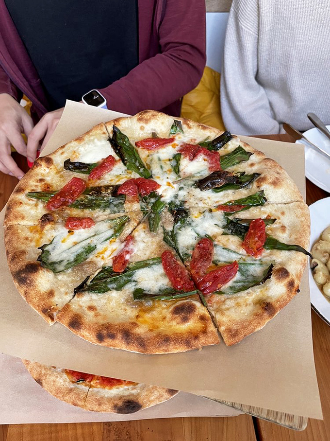 Spring on a pizza&mdash;asparagus and tomatoes playing nicely together on a canvas of perfect crust and melted cheese.
