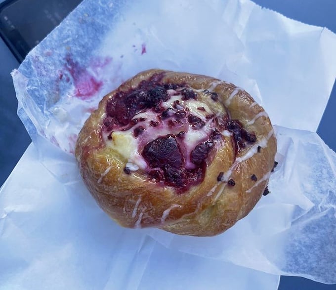This raspberry danish with its bright berry center surrounded by cream cheese cushion is what breakfast pastries dream of becoming.