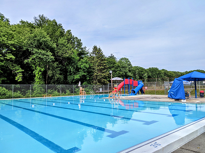 Recreation Park's pristine pool awaits summer splashers, a blue oasis promising relief from humidity that could curl even the straightest New England hair.