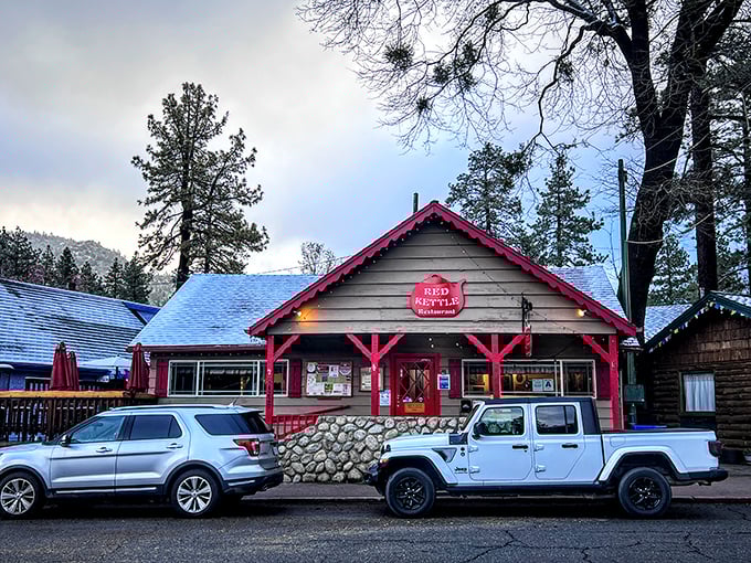 The Red Kettle's cheerful facade promises comfort food that hugs your insides. Breakfast tastes better at 5,000 feet—it's just science.