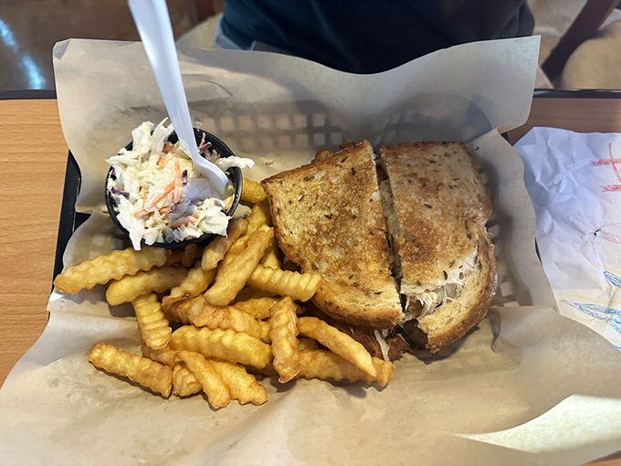 A sandwich and fries served in a basket lined with paper&mdash;the universal signal that you're about to experience something honest, unpretentious, and utterly satisfying.