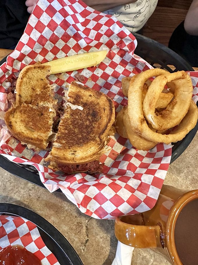 A grilled sandwich that proves bread, meat, and cheese are humanity's greatest collaboration. Those onion rings aren't just sides&mdash;they're co-stars.