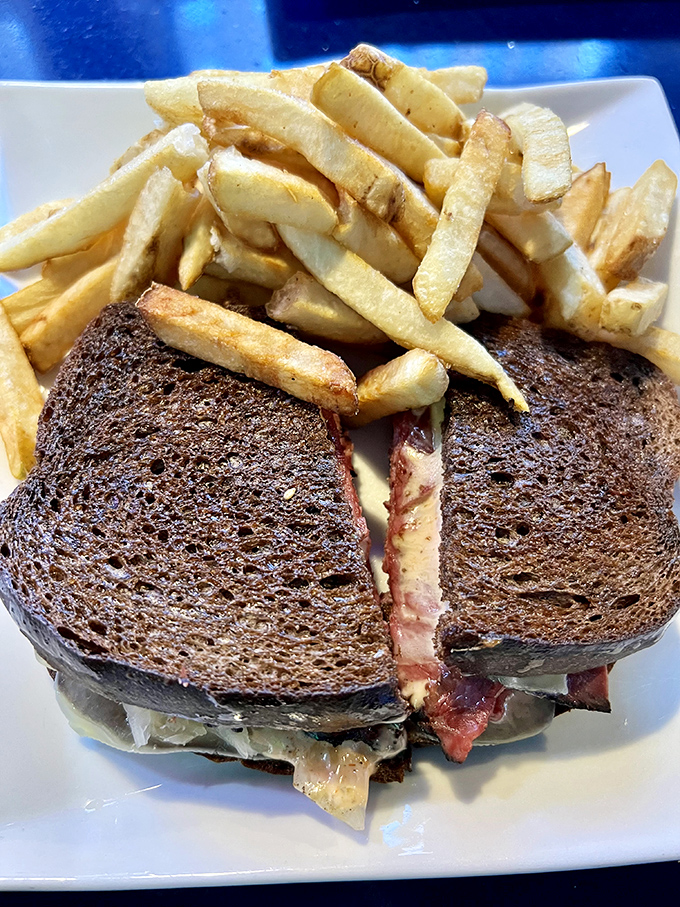 A Reuben sandwich and fries that could end family feuds. That melty cheese-to-corned beef ratio is mathematical perfection.