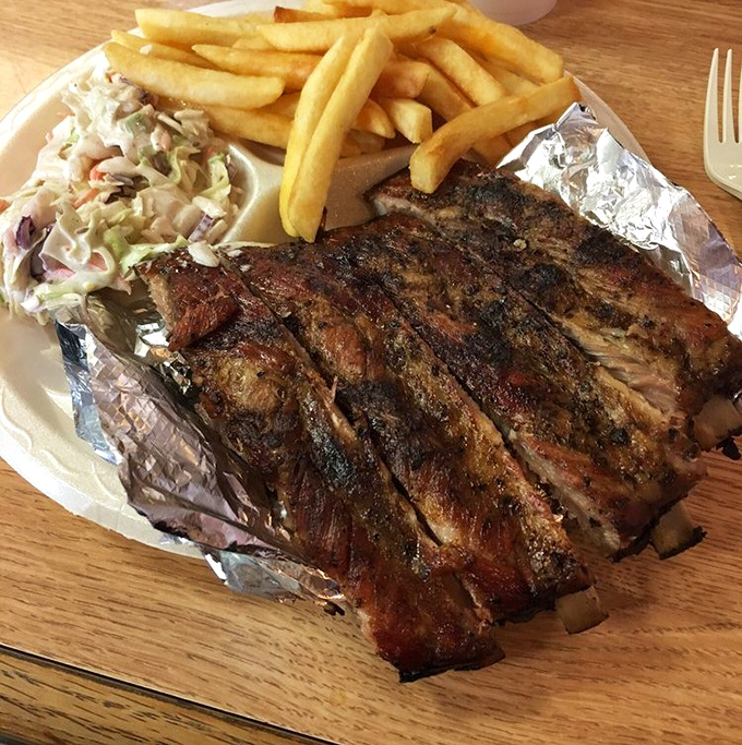 These ribs don't just fall off the bone &ndash; they practically leap onto your fork, bringing along perfect bark and a pink smoke ring.